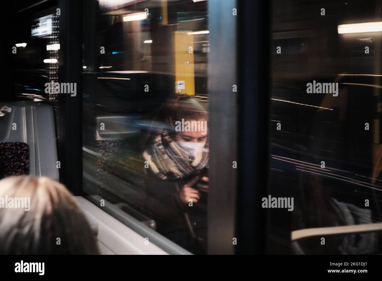Girl on bus looking at phone Stock Photo - Alamy