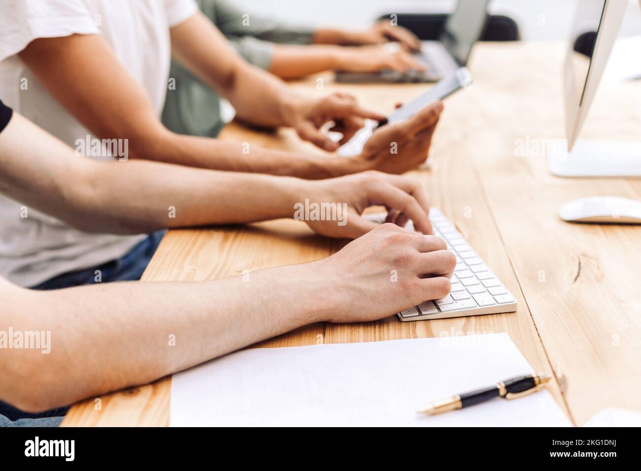 close up. a group of employees use devices in the office Stock Photo ...