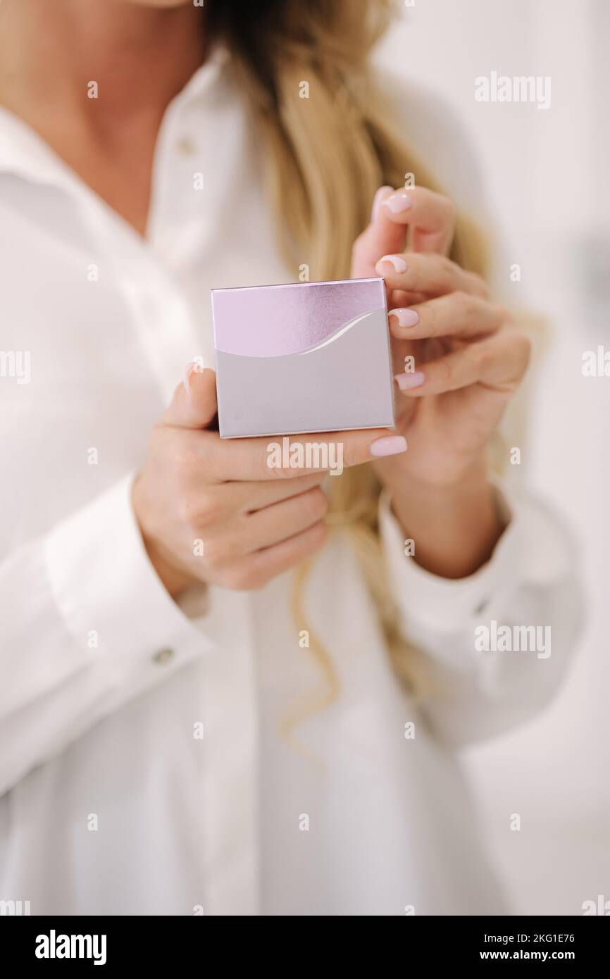 Portrait of woman hold box with cosmetic. Gorgeous female. Close-up ...