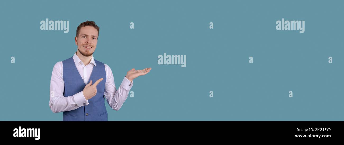 Surprised young man showing hand gesture in blank copy. Surprised man ...