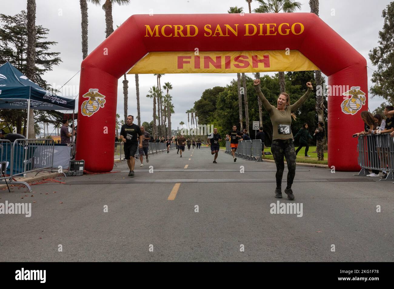 Boot Camp Challenge participants cross the finish line in a race at ...