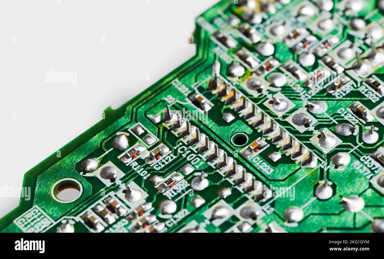 Green printed circuit board over white background, micro electronics ...