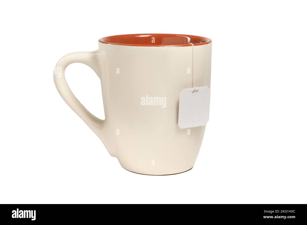 Beige ceramic mug with teabag label. isolated on white background Stock Photo - Alamy