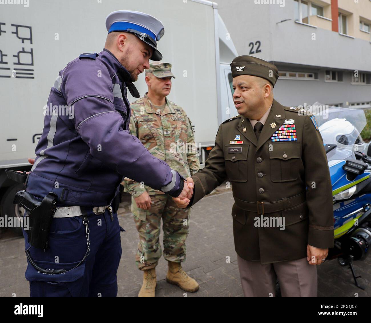 U.S. Army Area Support Group Poland Commander Col. Jorge Fonseca shakes ...