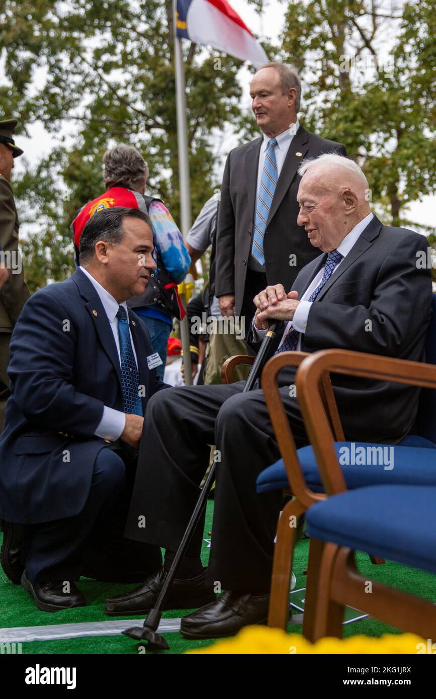 Retired U.S. Marine Corps Master Sgt. Fernando Schiefelbein, left ...