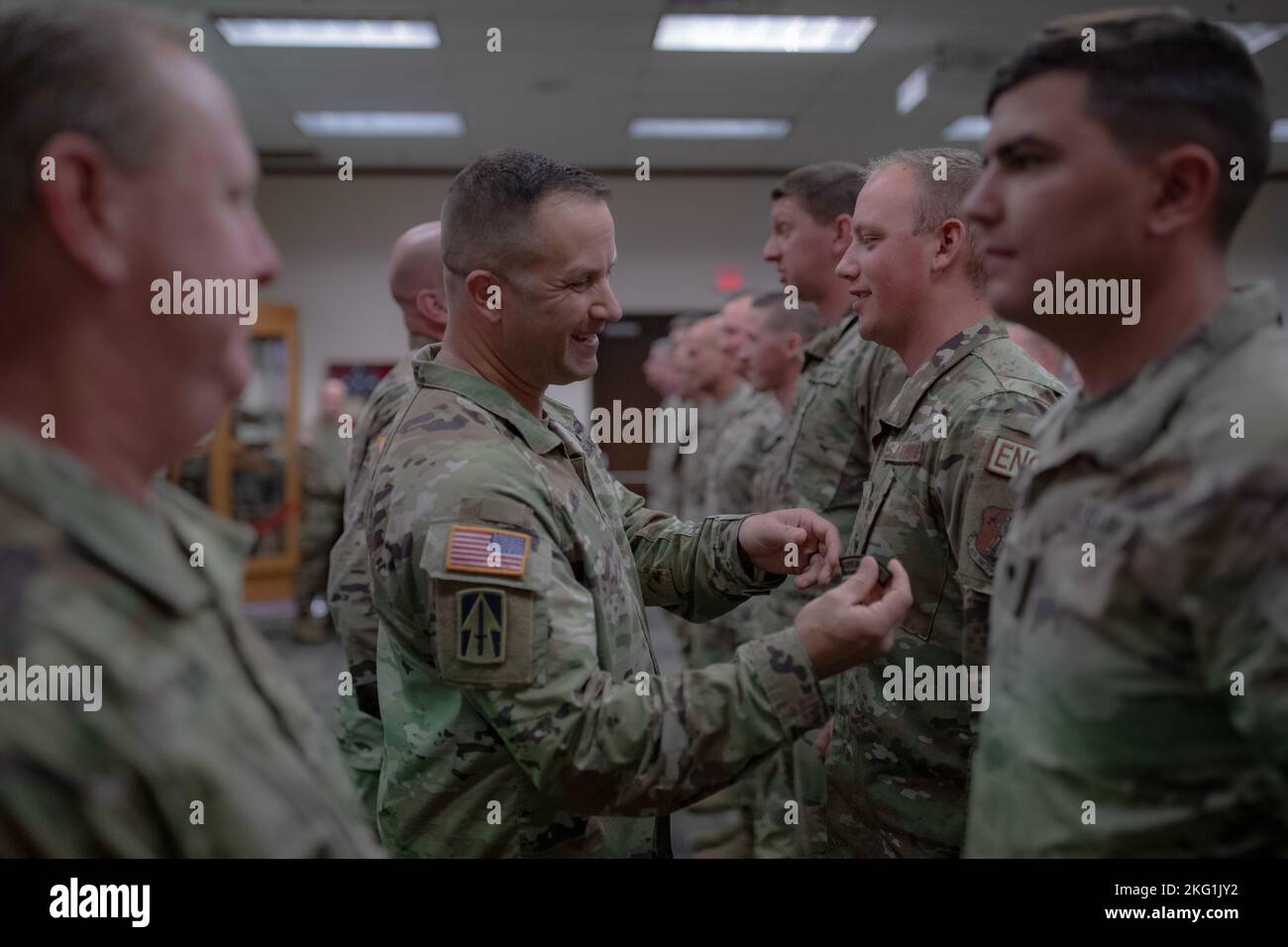 Brig. Gen. Justin Mann, director of Joint Staff, presents the Governor ...