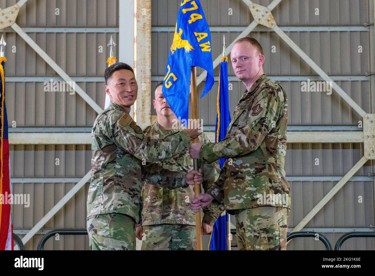 Col. Jun Oh, 374th Operations Group commander, left, passes the 374th ...