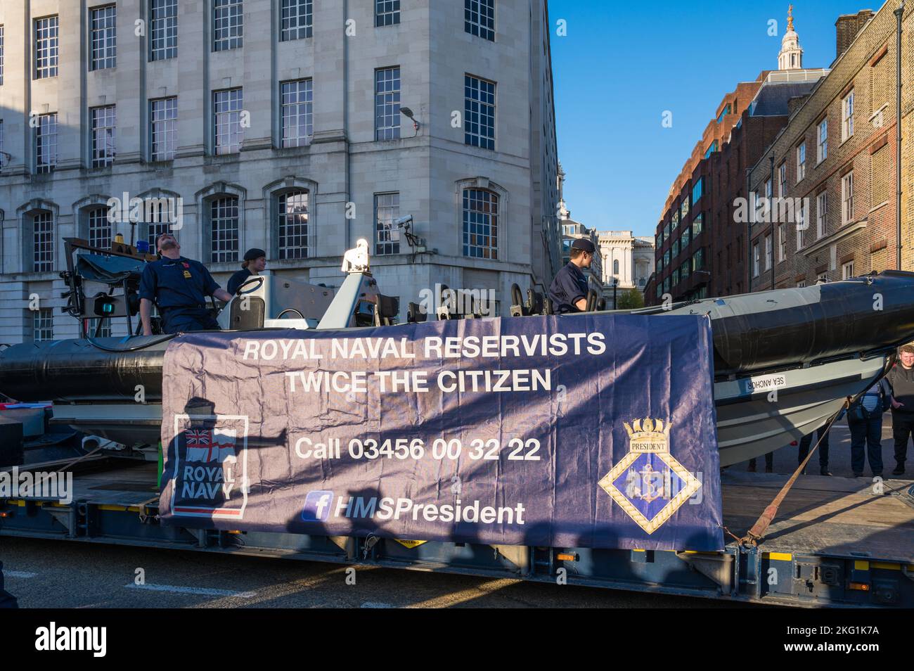 Royal Naval Reservists ride trailer mounted rib boat in the procession ...