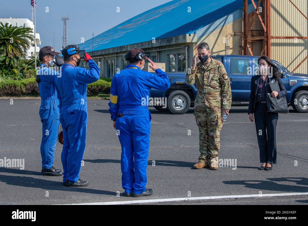Col. Andrew L. Roddan, 374th Airlift Wing commander, returns a salute ...