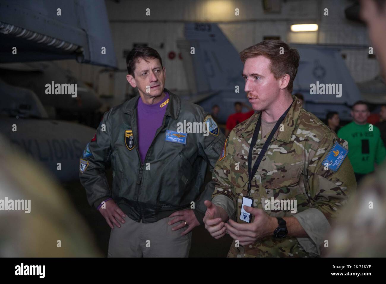 Lt. Tyler Mulloy, from Fairfax, Virginia, right, assigned to Carrier ...