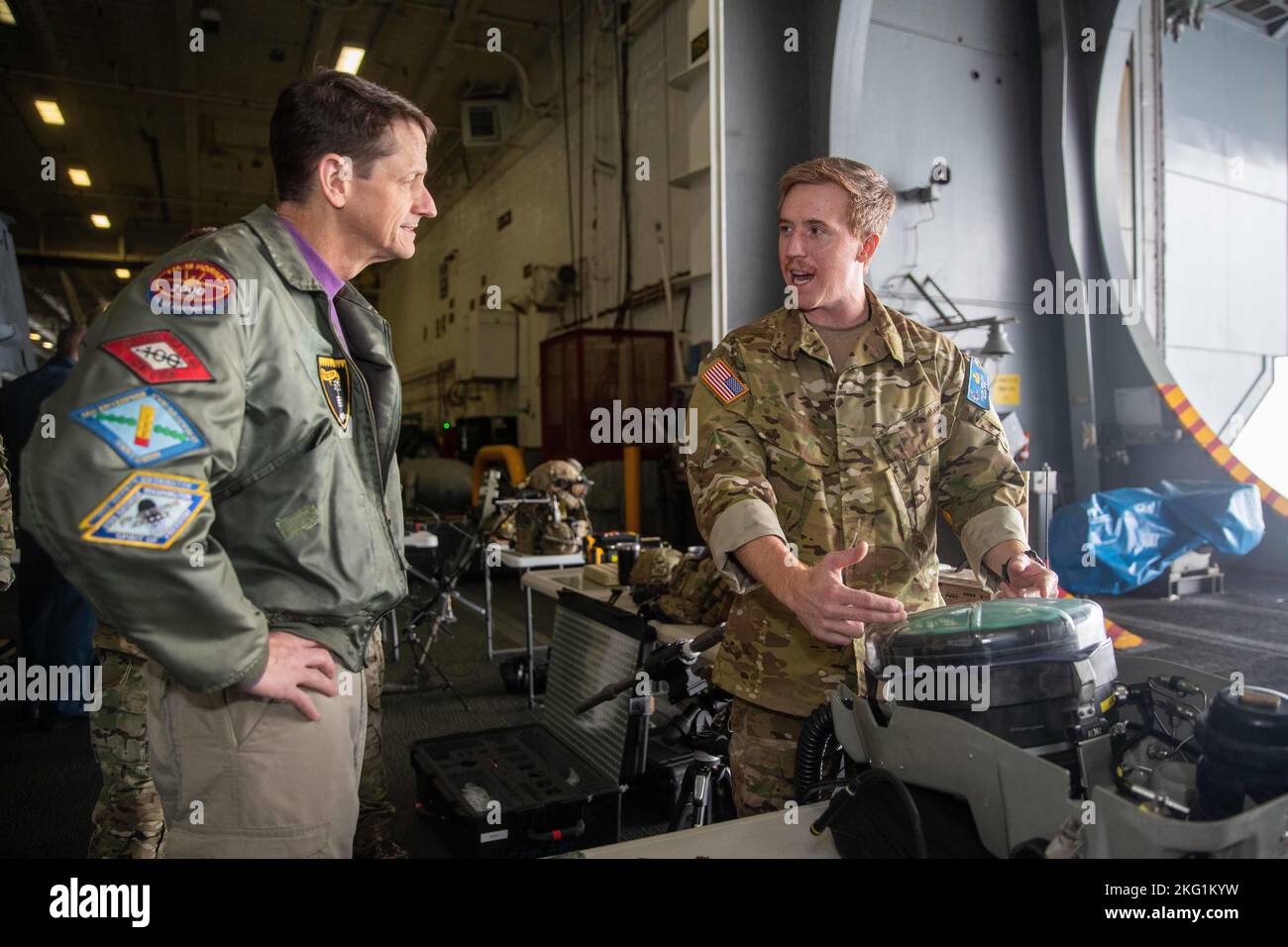 Lt. Tyler Mulloy, from Fairfax, Virginia, right, assigned to Carrier ...