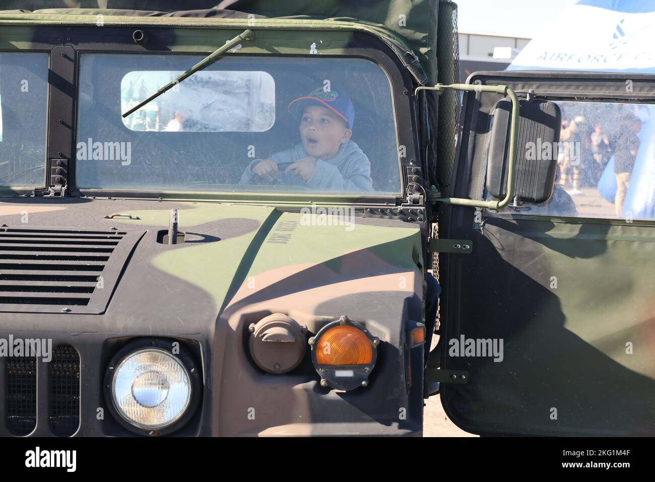 A young spectator at the annual Blue Angels airshow sits inside of a M ...