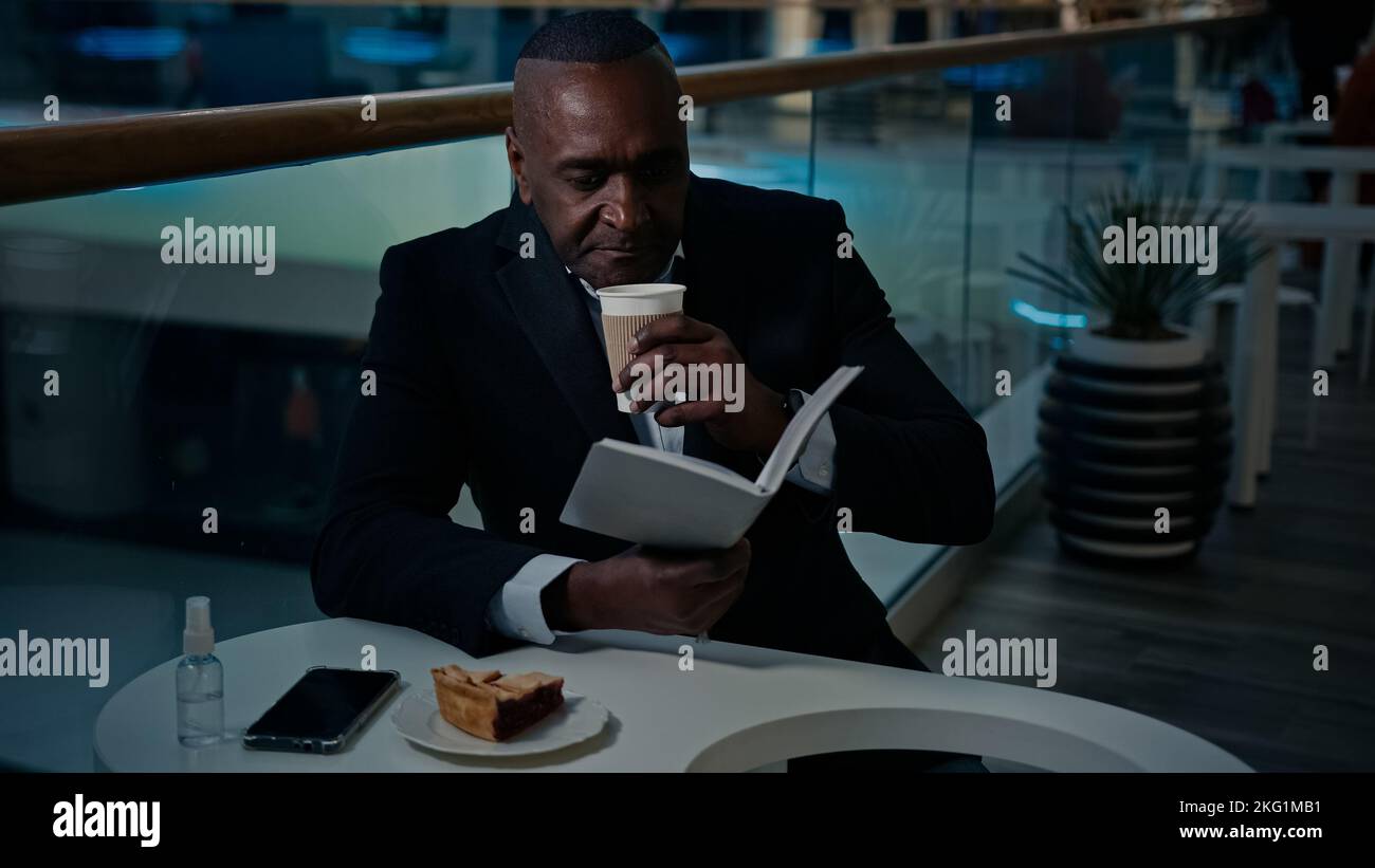 African man worker businessman employer entrepreneur sitting at table ...