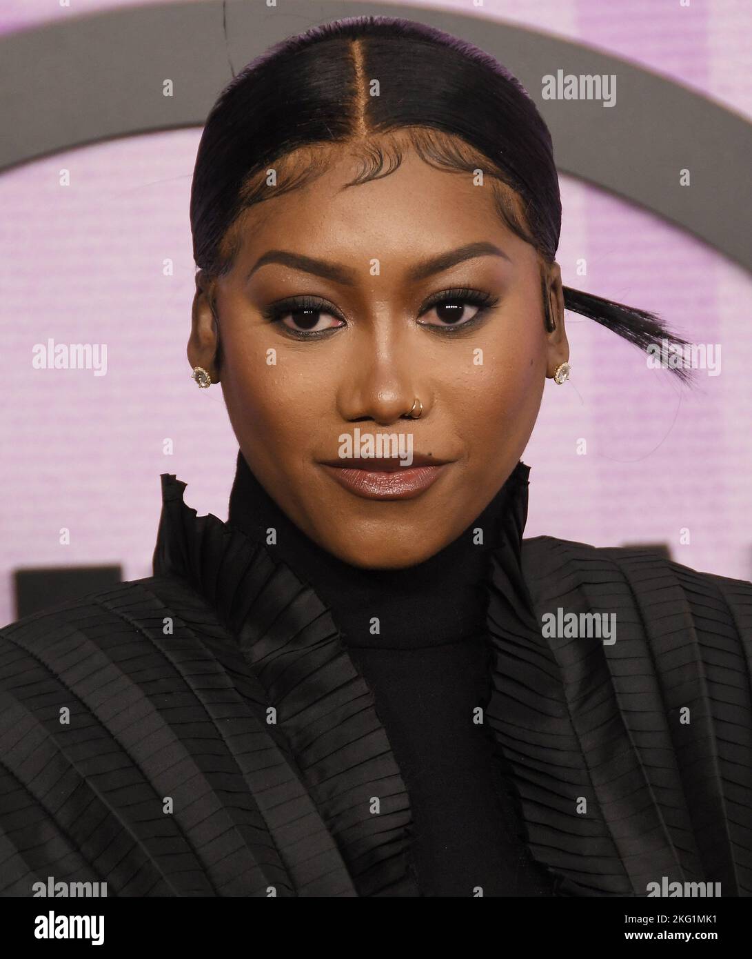 Muni Long arrives at the 2022 American Music Awards held at the ...