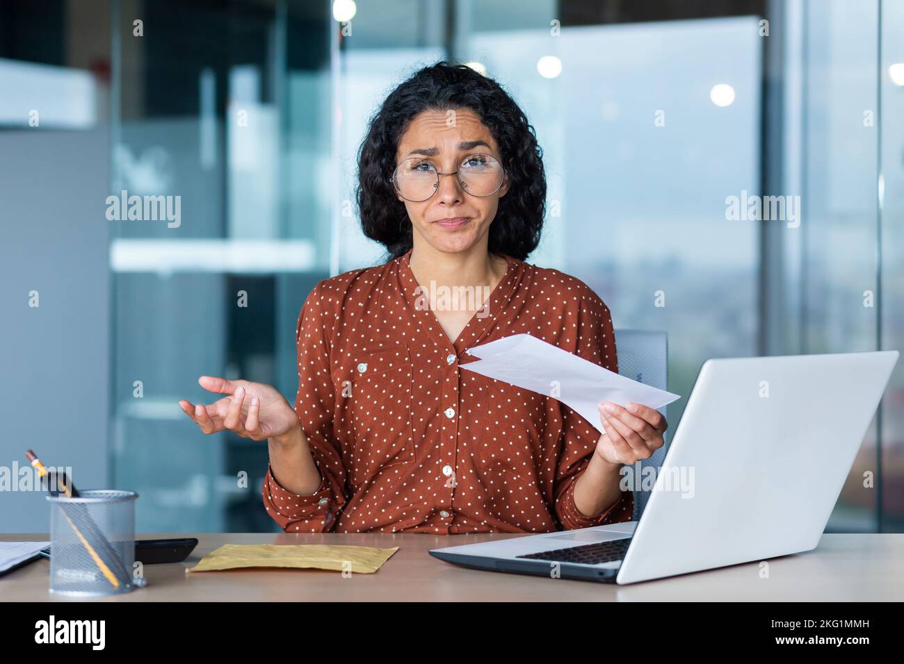 Portrait of disappointed business woman, latin american received ...