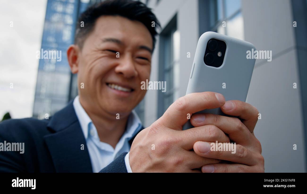 Close up bottom view happy positive smiling formal Asian middle-aged ...