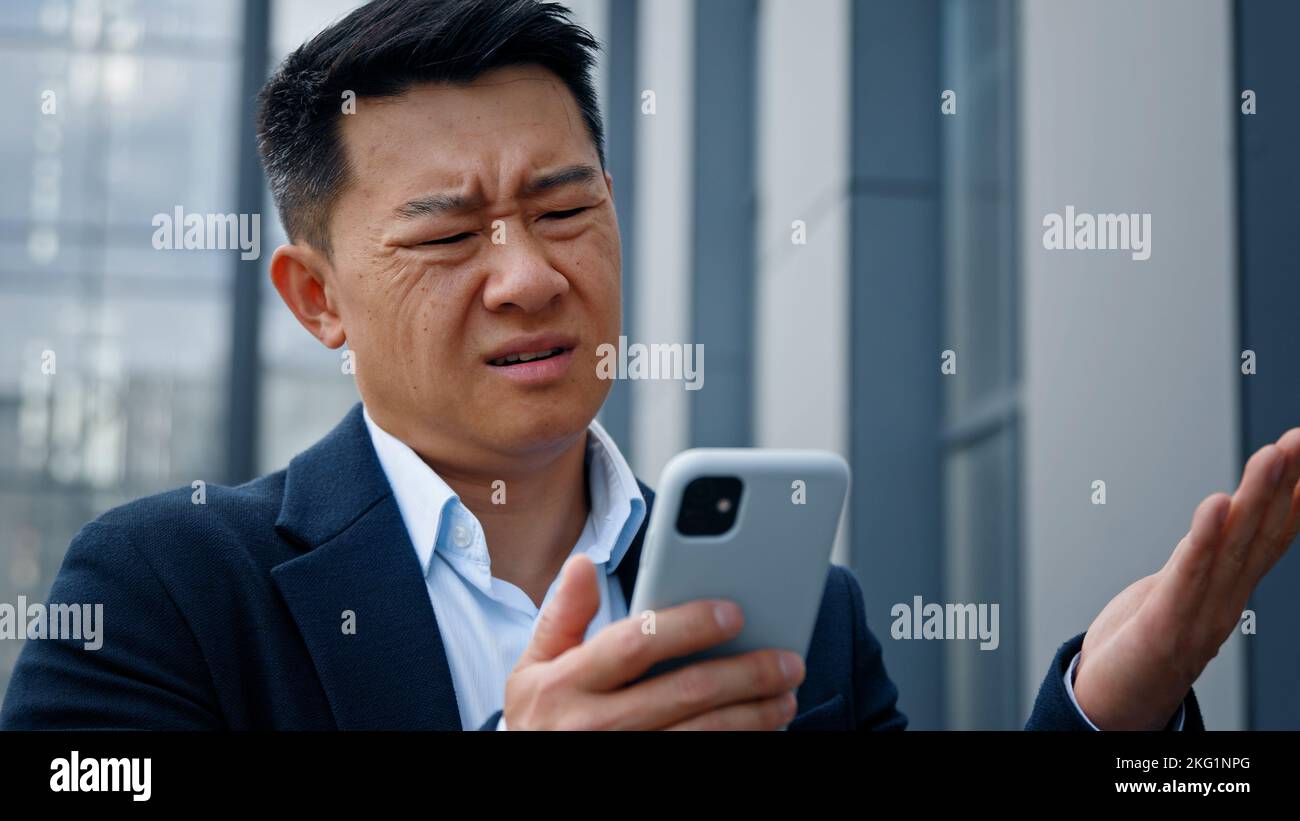 Close up Asian middle-aged adult man mad unhappy businessman feeling ...