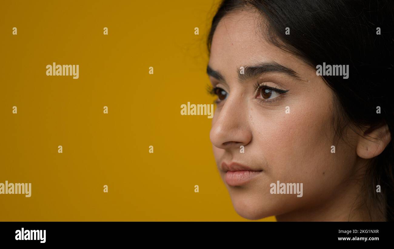 Close up portrait in studio yellow background Indian ethnic woman girl ... Close up portrait in studio yellow background Indian ethnic woman girl ...