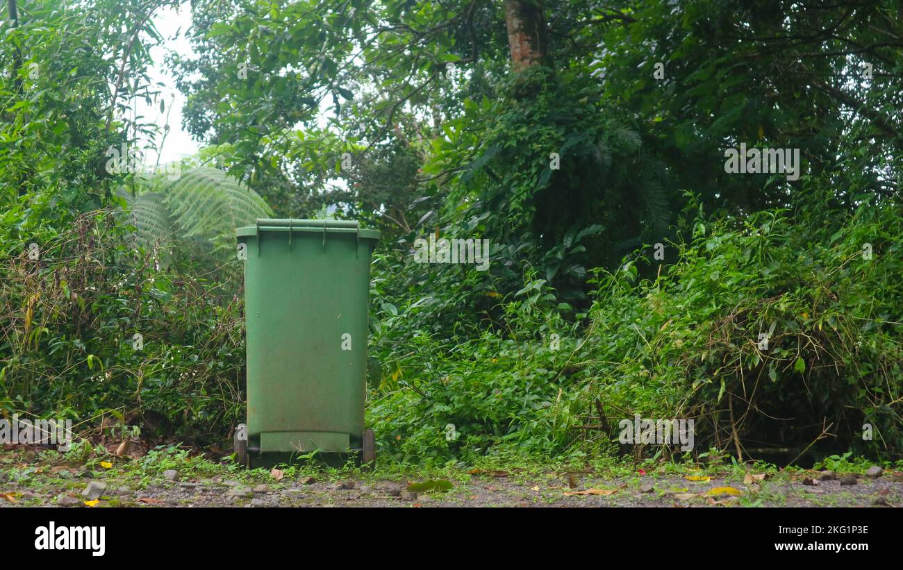green trash bins in tourist spots Stock Photo - Alamy