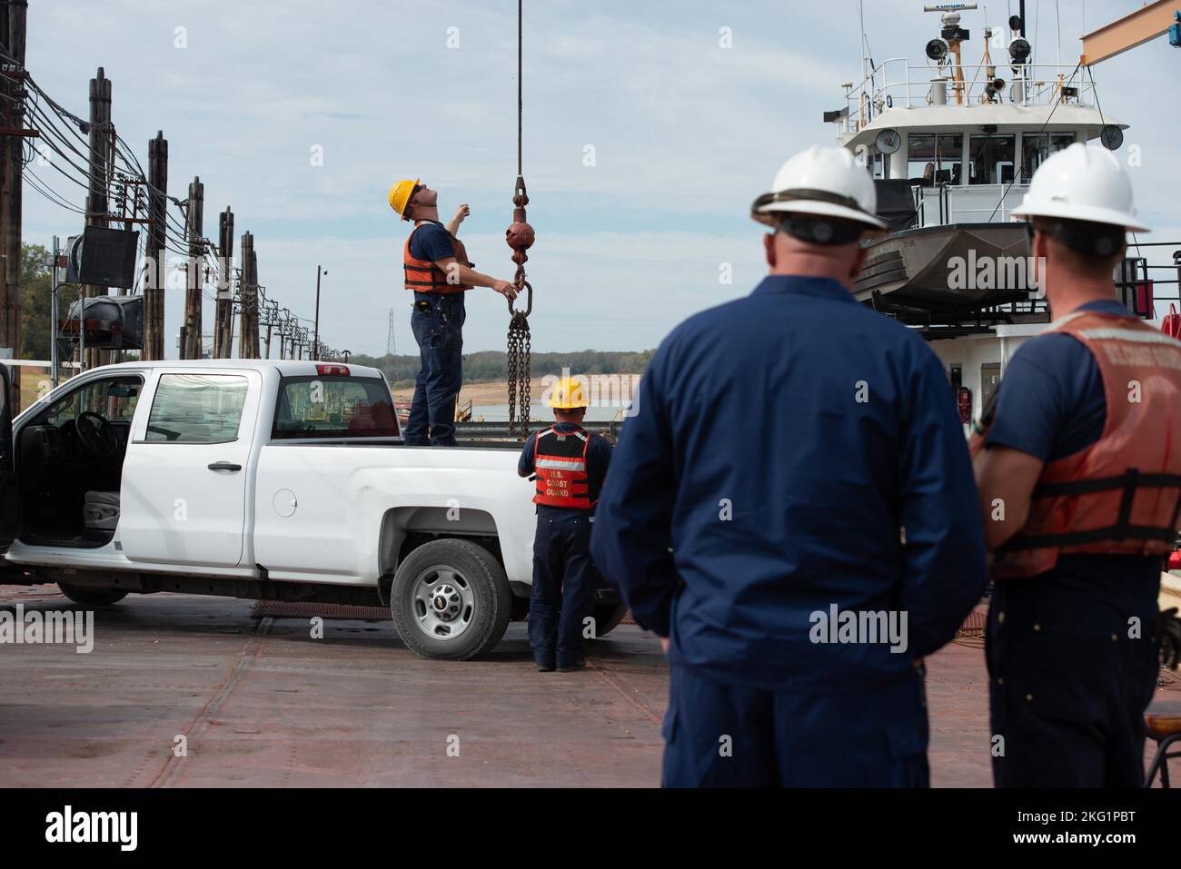 Coast Guard Cutter Patoka crew load cement weights onboard Coast Guard ...