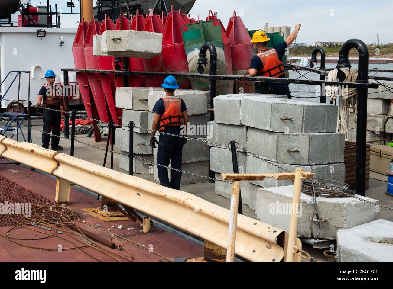 Coast Guard Cutter Patoka crew loads cement weights on board Coast ...