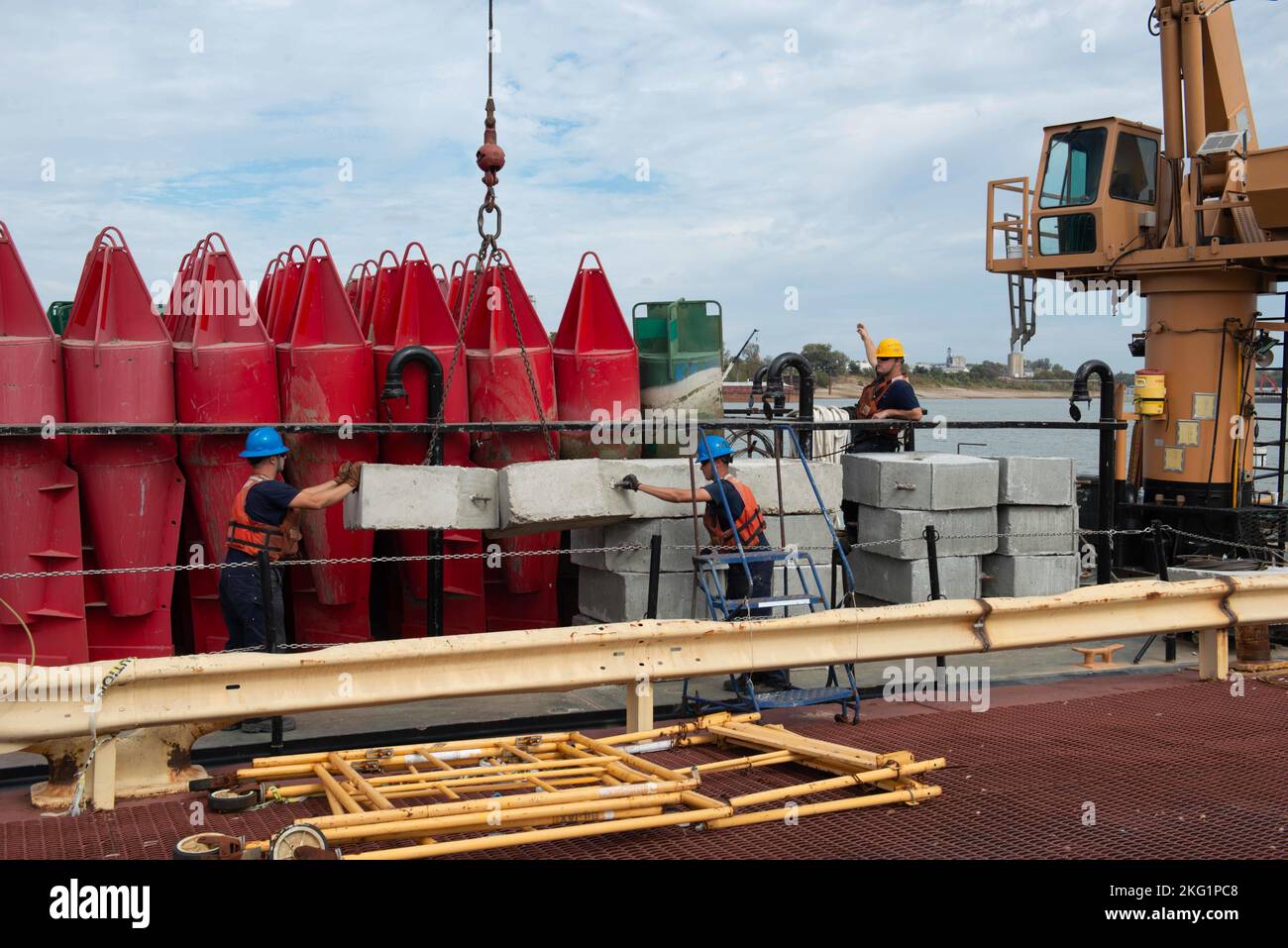 Coast Guard Cutter Patoka crew loads cement weights on board Coast ...