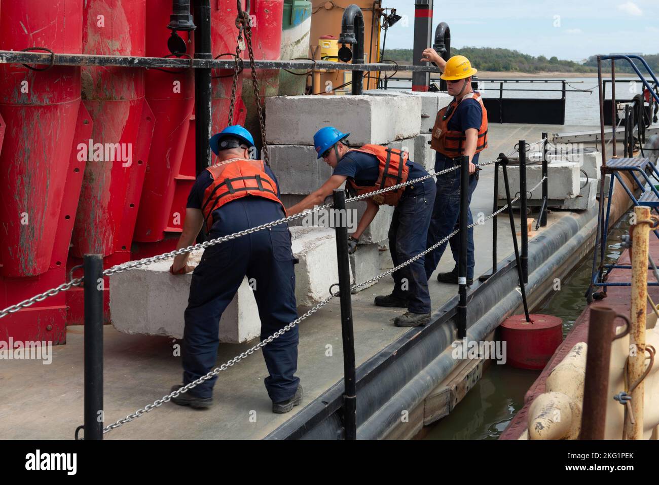 Coast Guard Cutter Patoka crew loads cement weights on board Coast ...