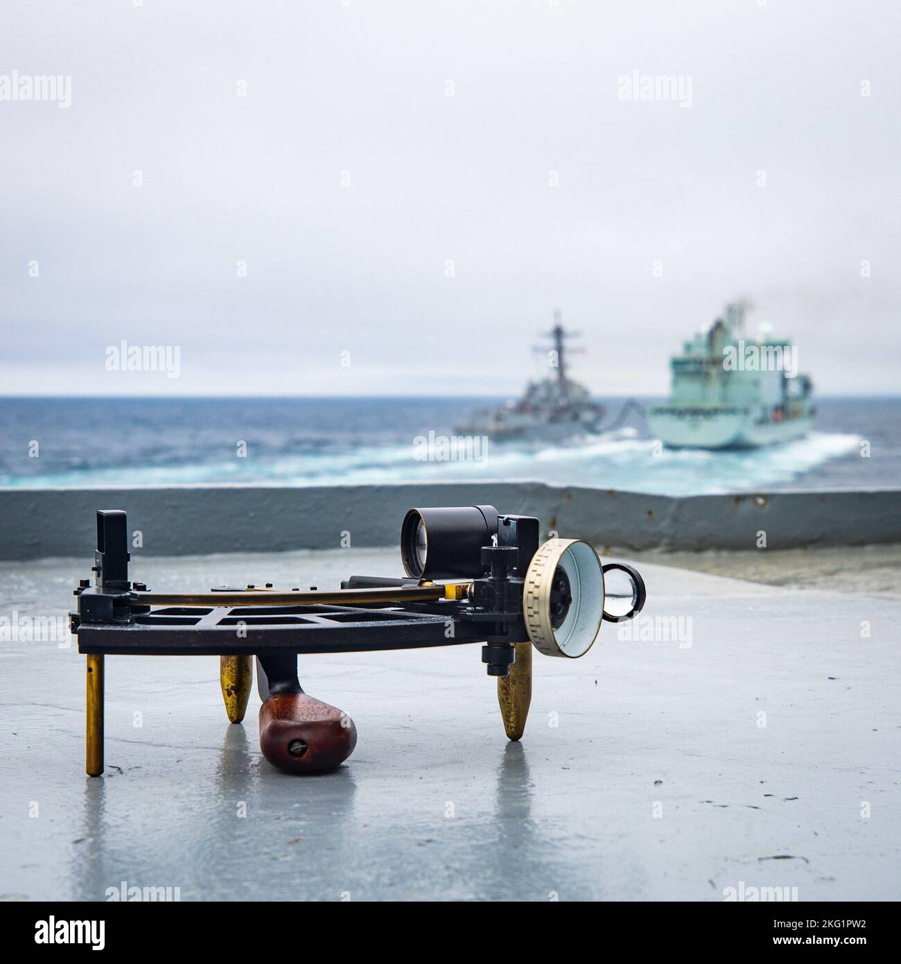 A sextant rests on the port bridge-wing of the Arleigh Burke-class ...