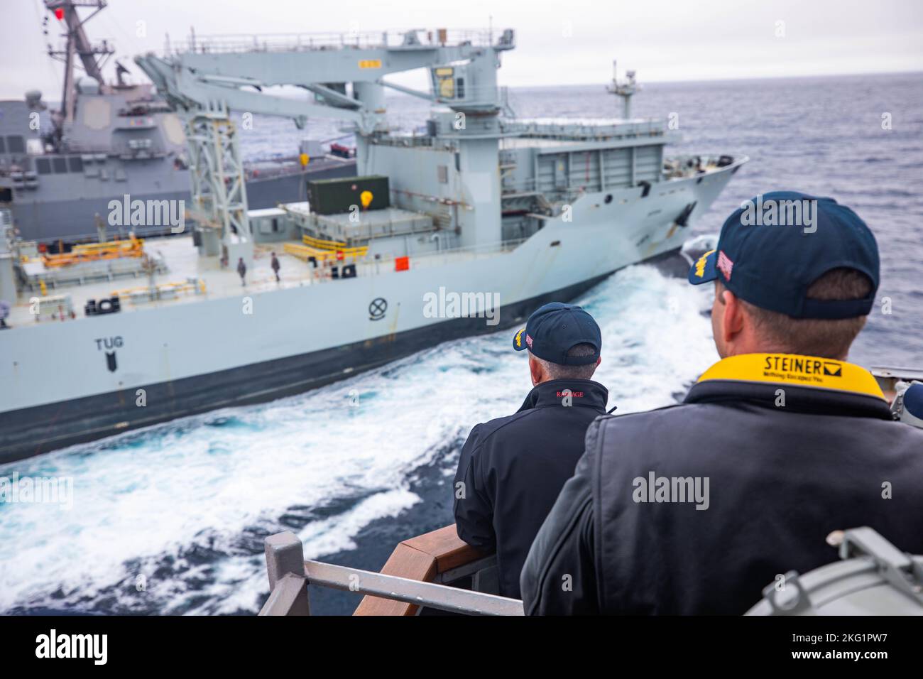 Cmdr. James Walker, left, the commanding officer of the Arleigh Burke ...