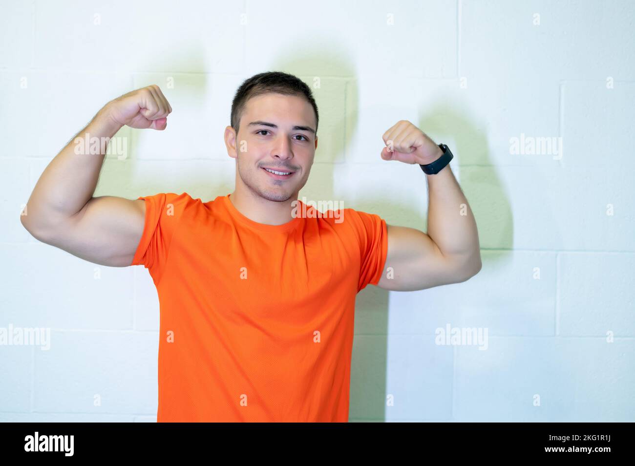 Muscular man flexing camera hi-res stock photography and images - Alamy
