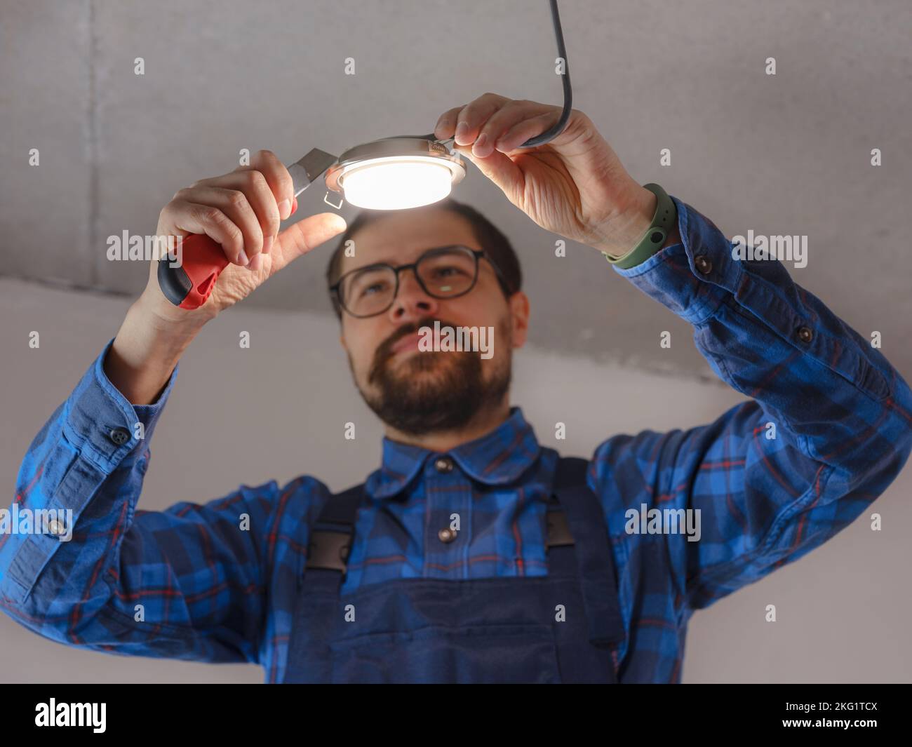 Electrician at work. Service for repair of electrical wiring and ...