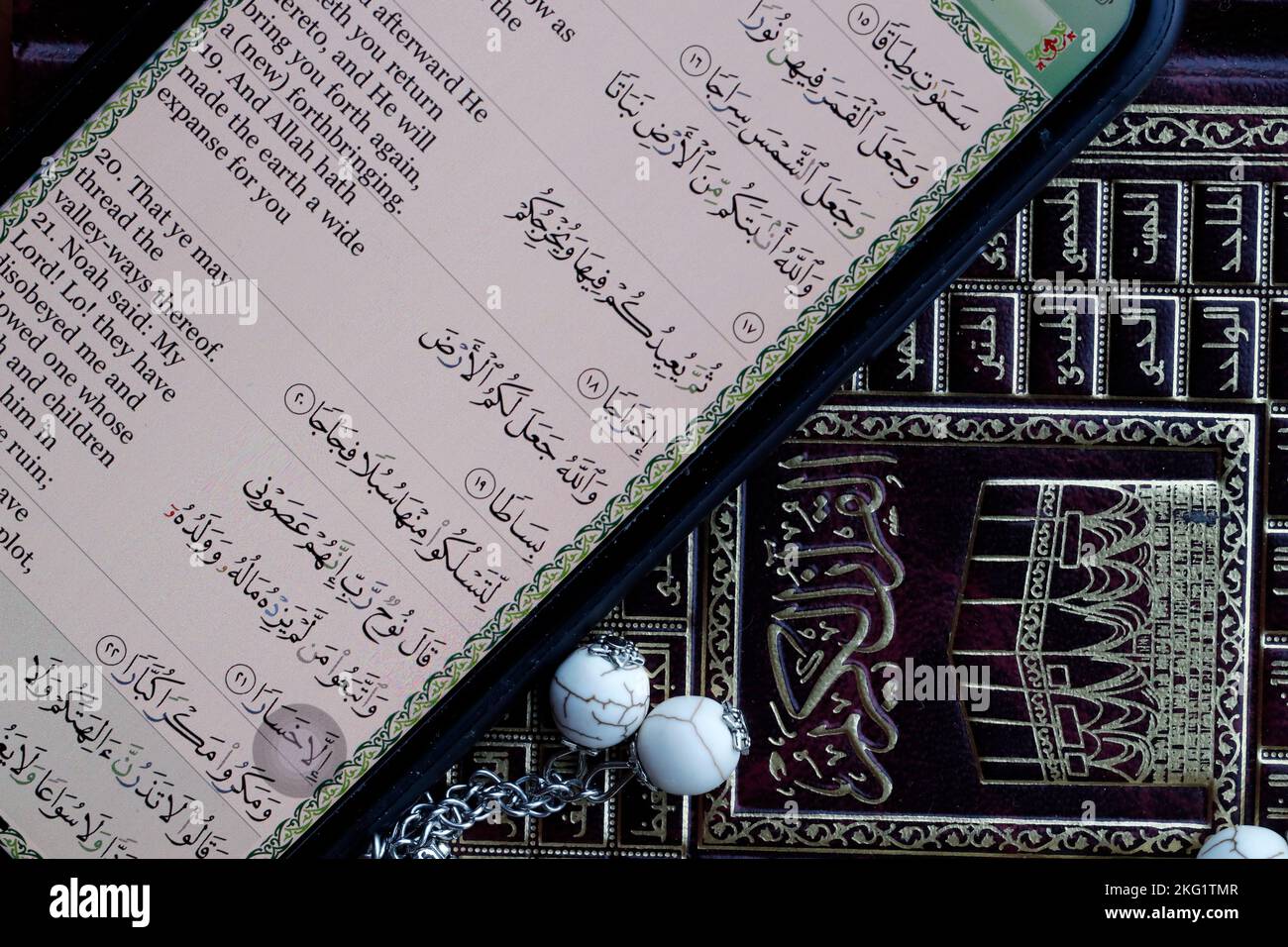 Digital Quran on a tablet and traditional Holy Quran on paper Stock ...