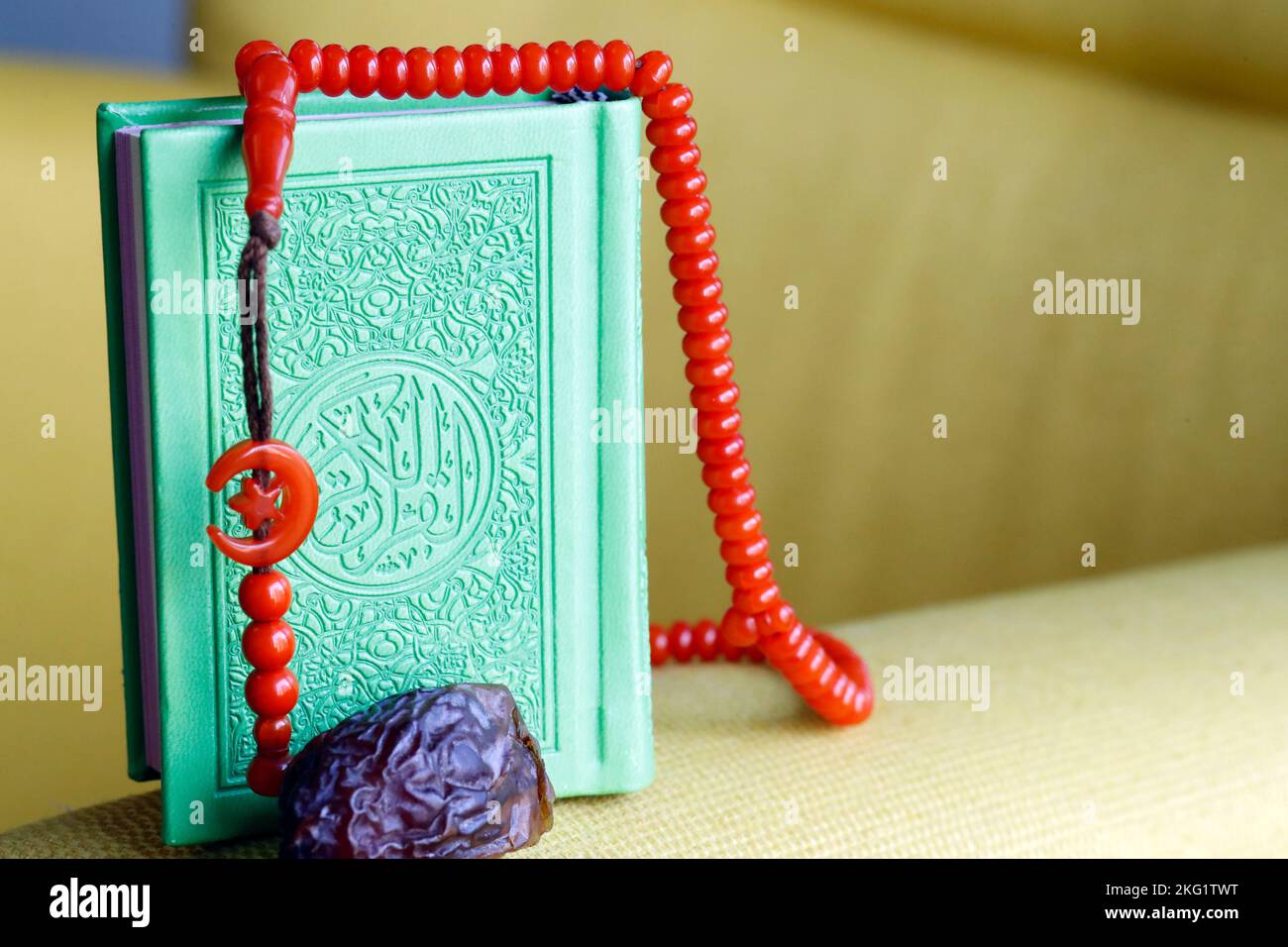 Holy Quran in arabic, muslim prayer beads, and fresh date. Islam ...
