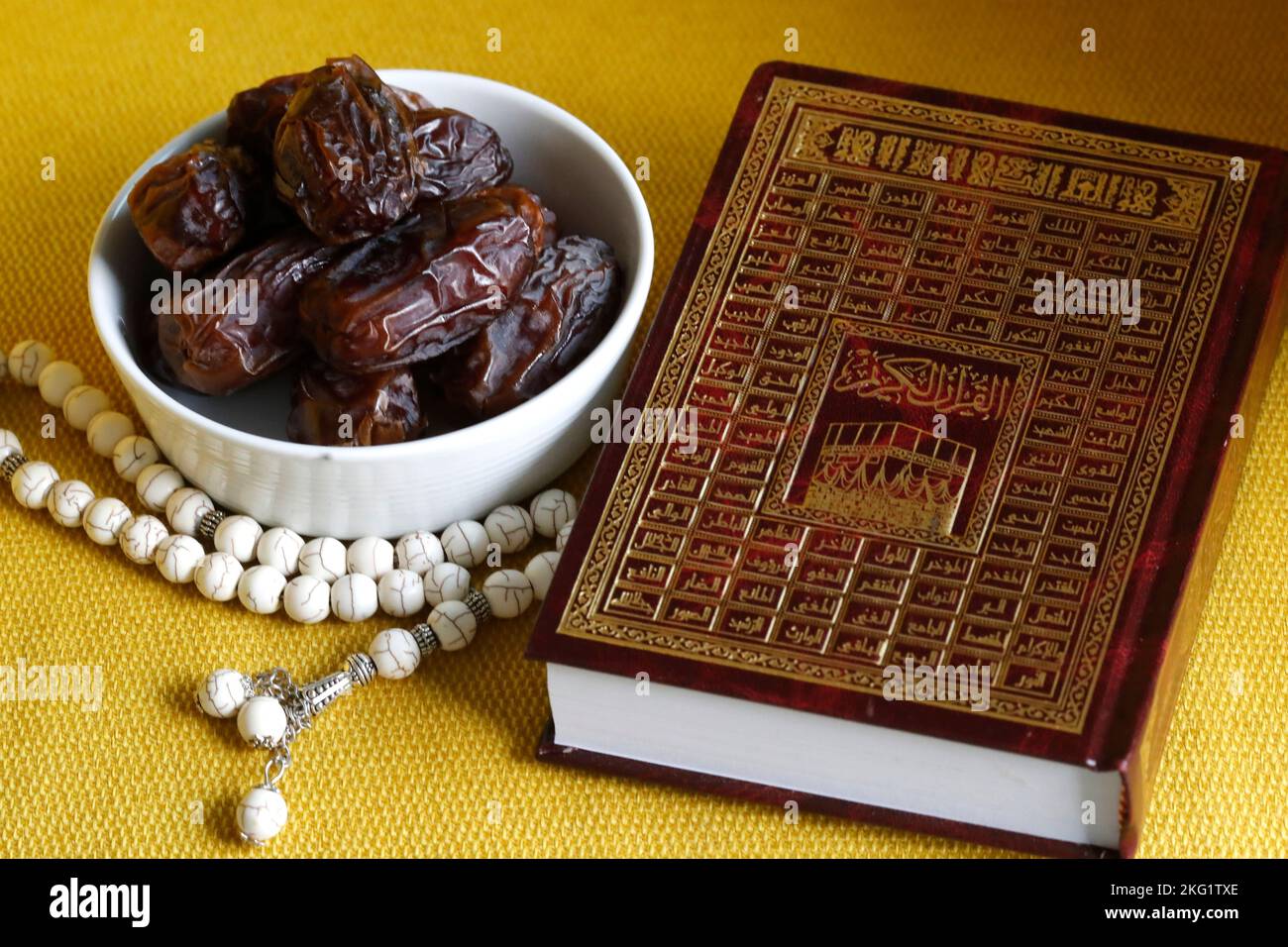 Holy Quran in arabic, muslim prayer beads, and fresh dates. Islam ...