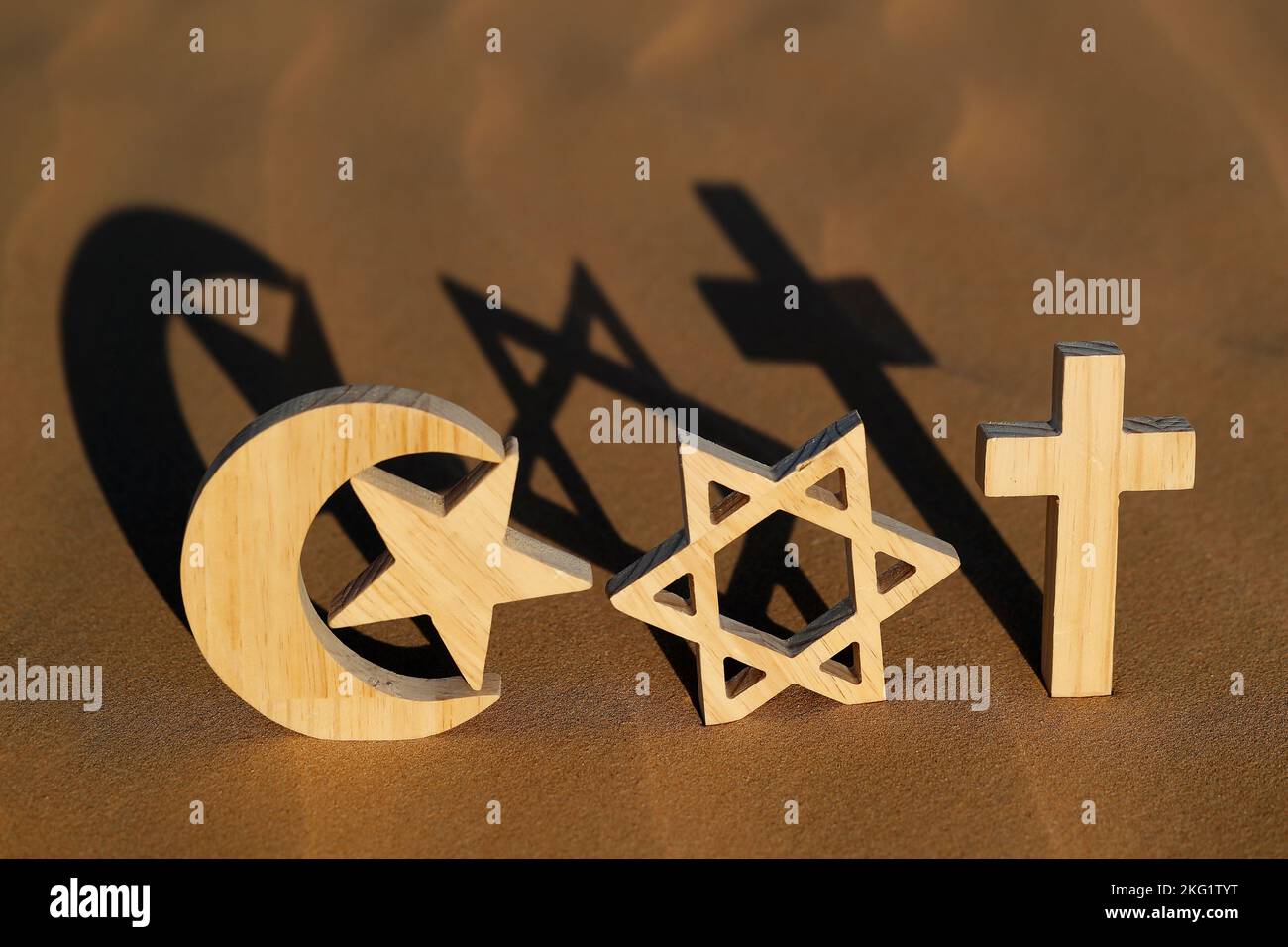 Religious symbols on sand at sunset : Jewish Star of David, Muslim Star ...