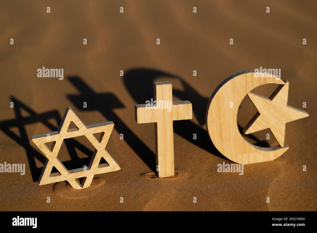 Religious symbols on sand at sunset : Jewish Star of David, Muslim Star ...