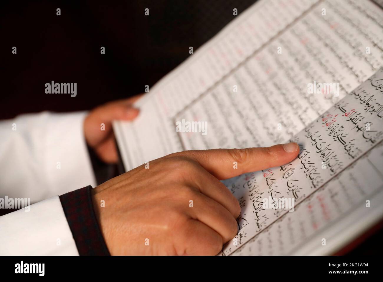 Muslim reading the Holy Quran in a mosque Stock Photo - Alamy