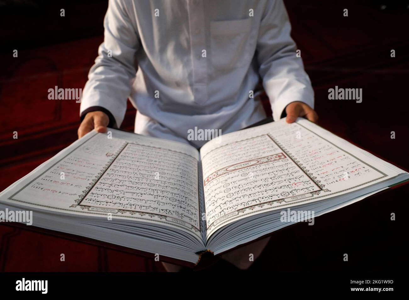 Muslim reading the Holy Quran in a mosque Stock Photo - Alamy
