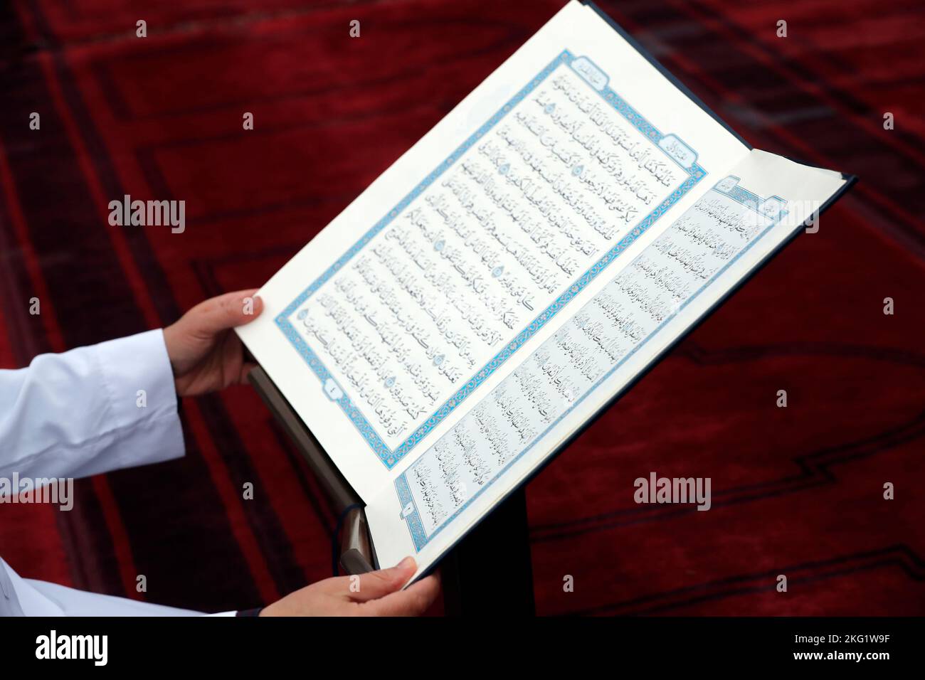 Muslim reading the Holy Quran in a mosque Stock Photo - Alamy