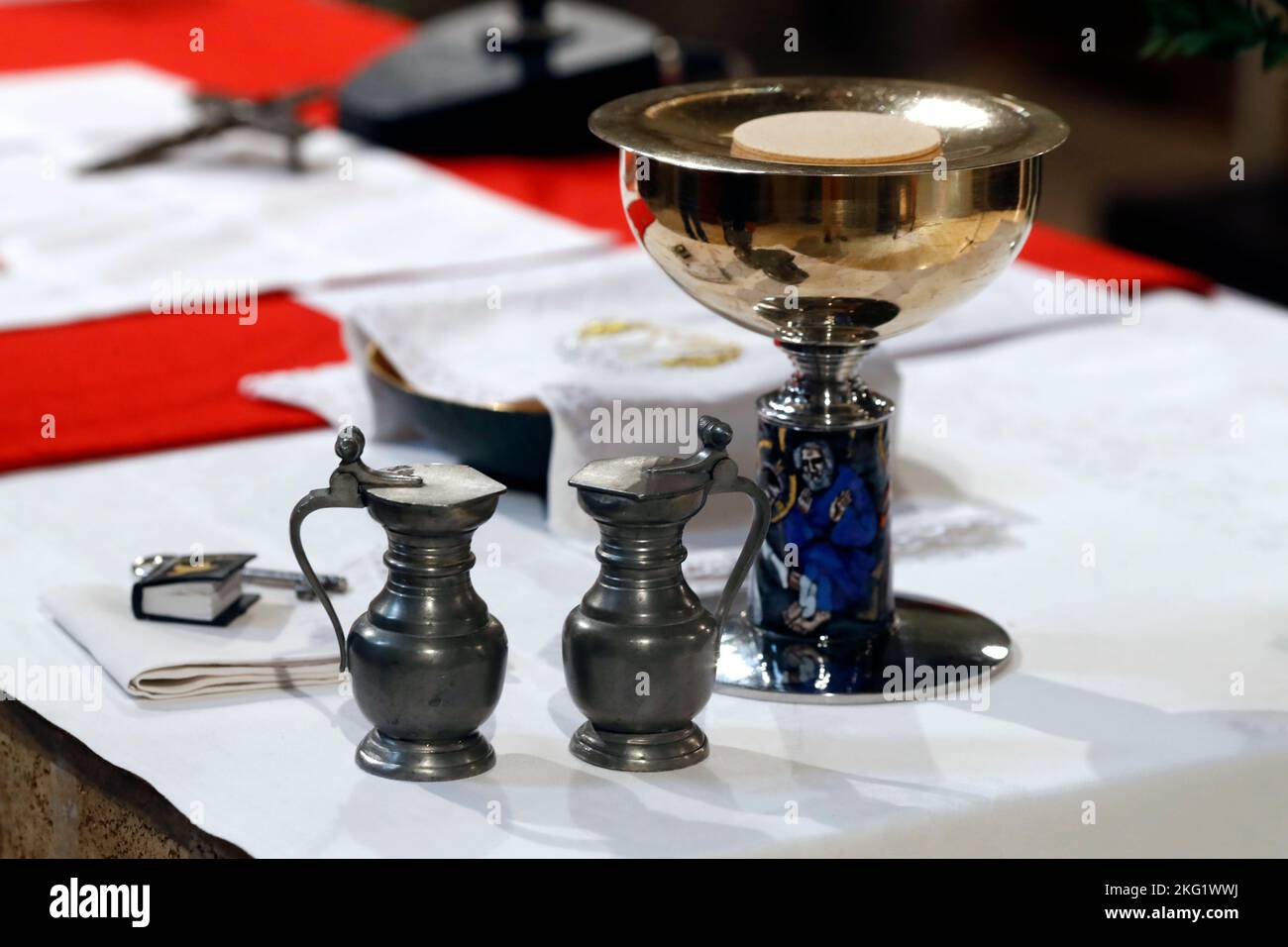 Catholic mass. Eucharist table with the liturgical items. Pair of ...