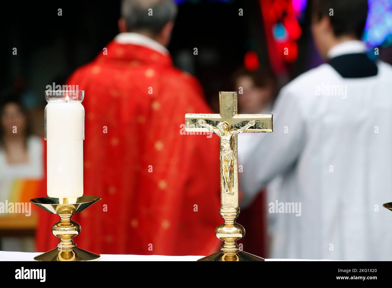 Priest at mass celebration in a catholic church. Church candel and ...