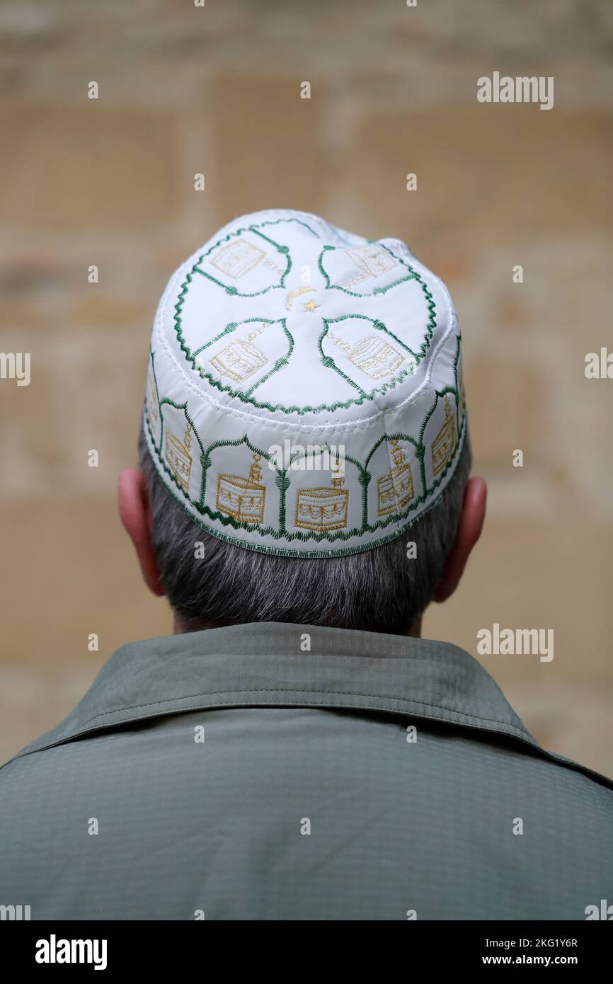 Back view of a muslim man praying with a kufi cap on head. Spain Stock ...