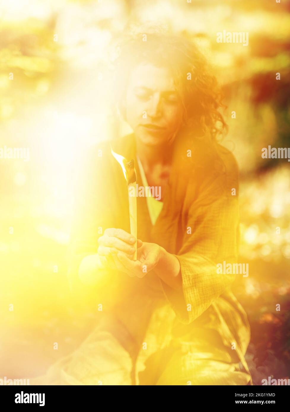 woman holds a lighted body candle in her hands Stock Photo - Alamy