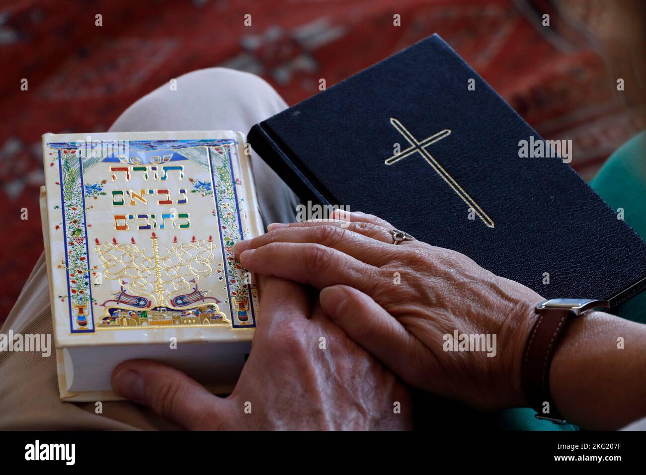 Jewish man and christian woman reading a Torah and a Holy Bible ...