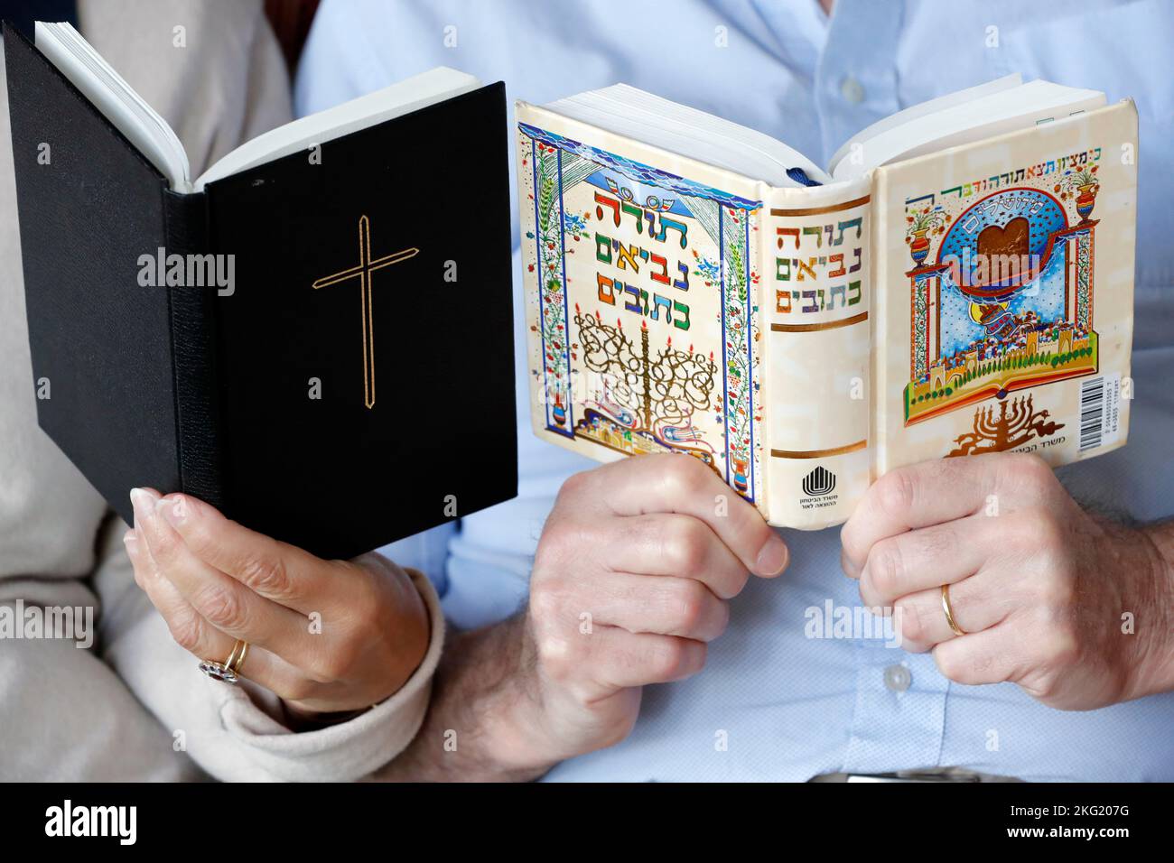 Jewish man and christian woman reading a Torah and a Holy Bible ...