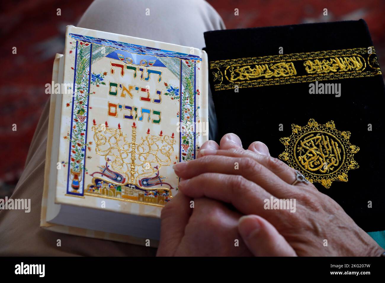 Jewish woman and muslim man reading a Torah and a Holy Bible. Couples ...