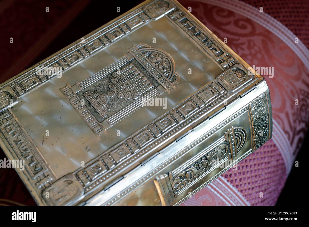 Old Torah book with the the five books of Moses. Cover with a menorah ...