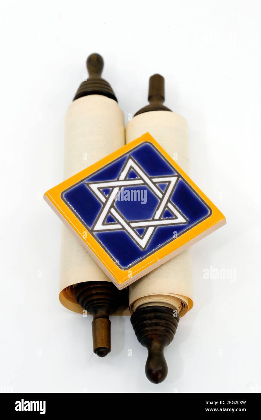 Star of David and small Torah scrolls. Symbol of Jewish identity and ...
