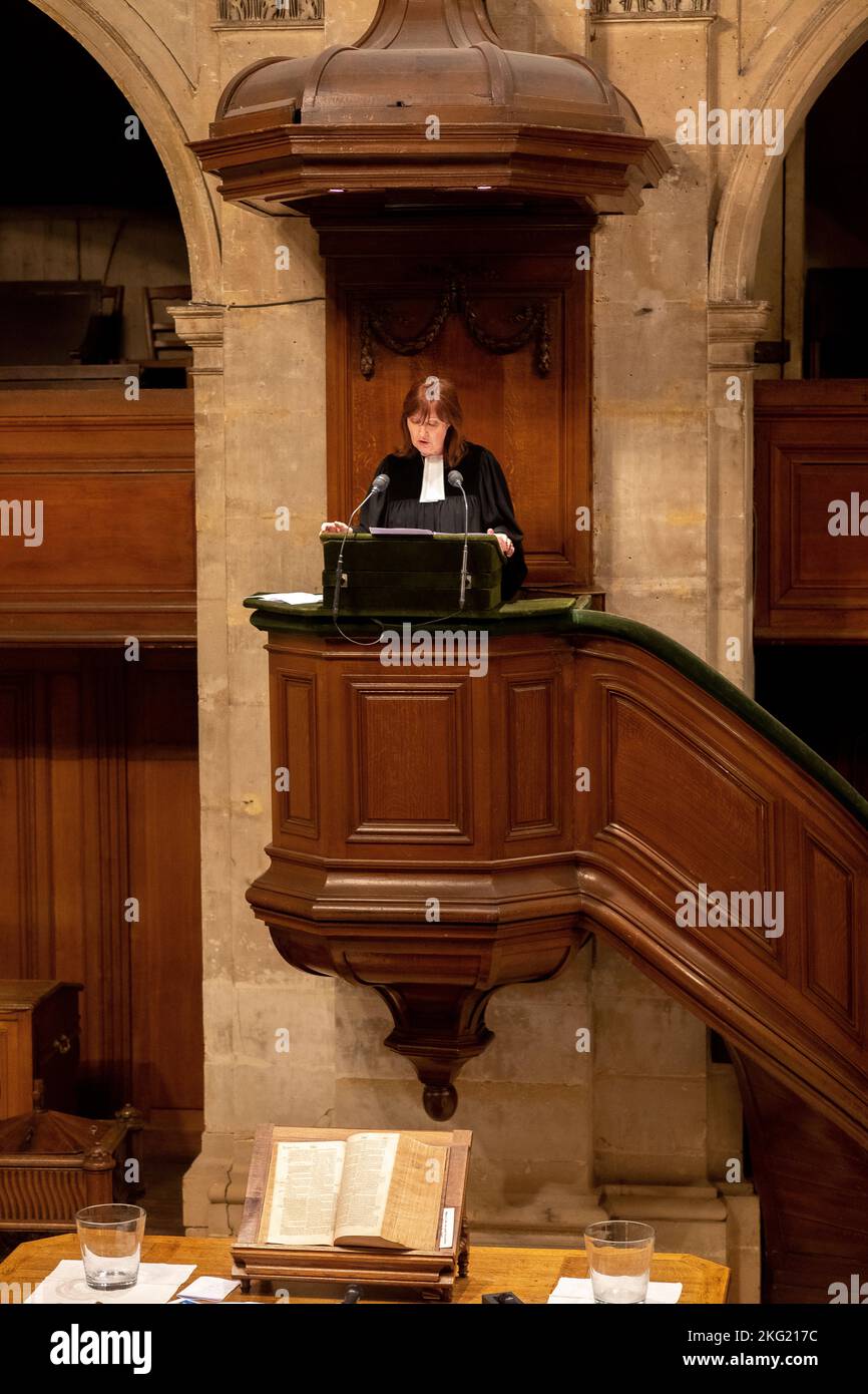 Clergywoman standing and speaking at the pulpit of the Oratoire du ...