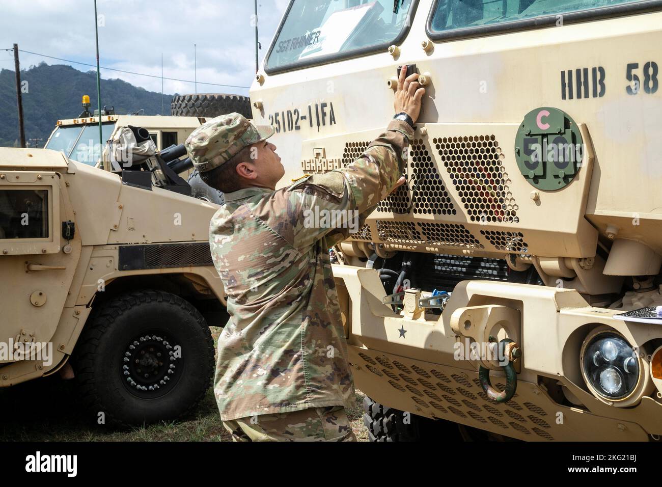 Civilian technicians assist Soldiers assigned to 2nd Battalion, 11th ...